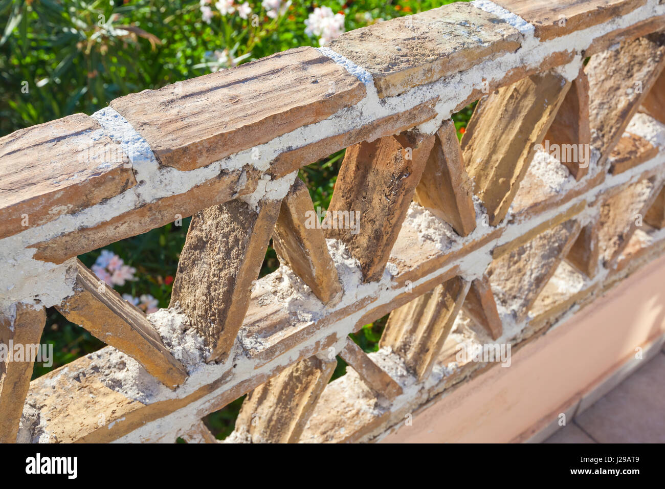 Old balcony railings made of clay blocks, Greek style architecture ...