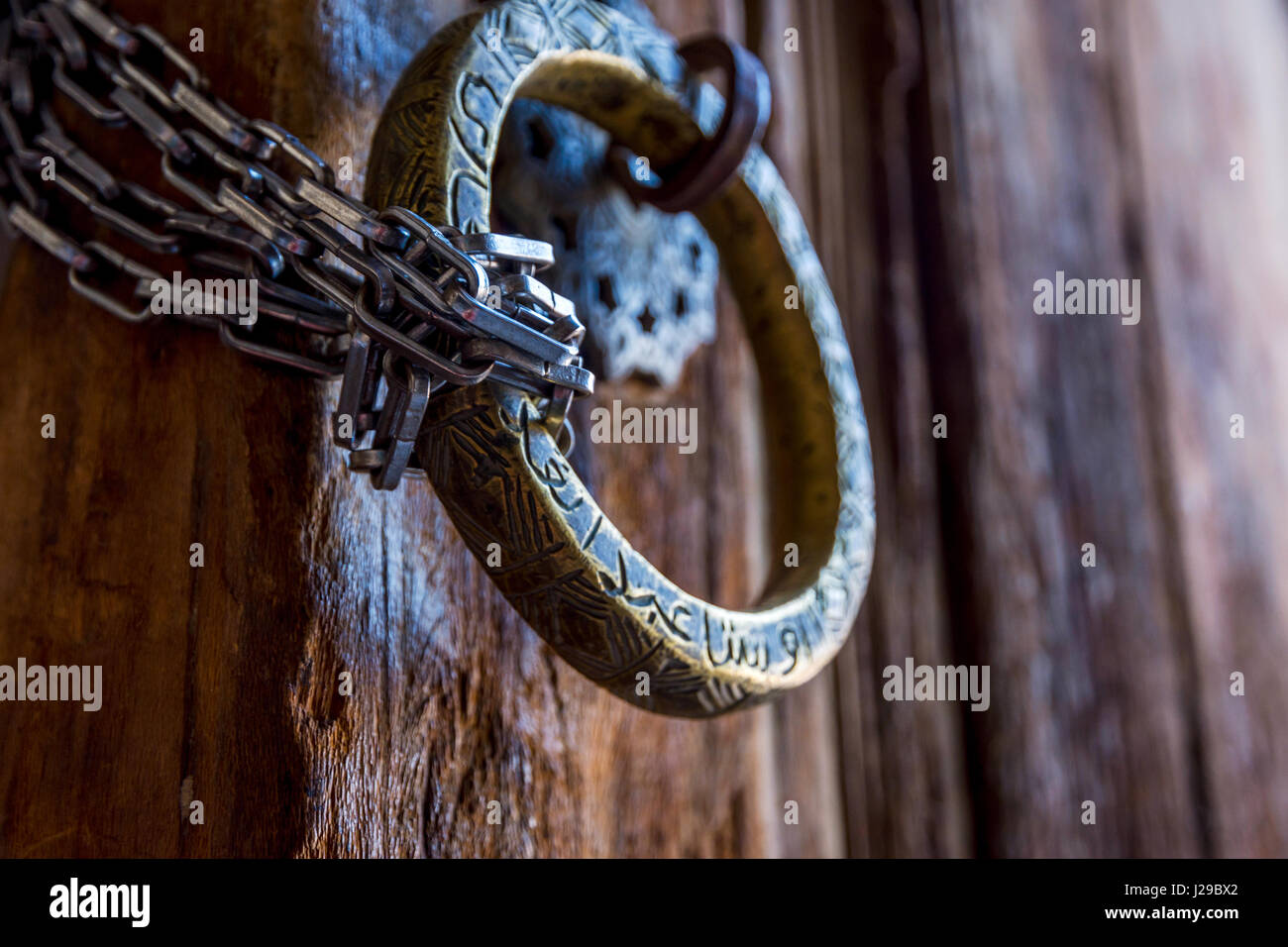 Old metal handle on the carved wooden door in Registan, Samarkand Stock ...