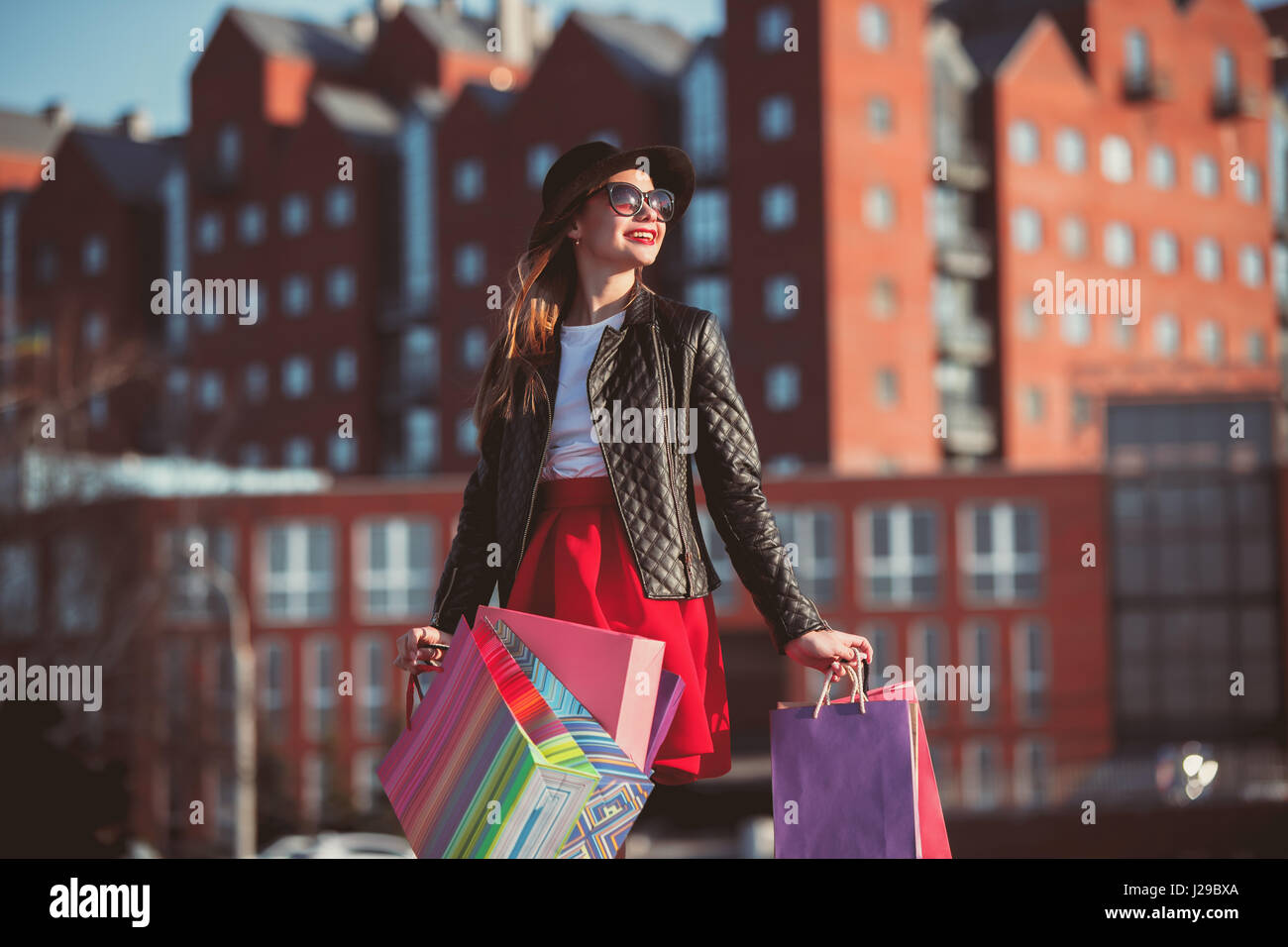 The girl walking with shopping on city streets Stock Photo - Alamy