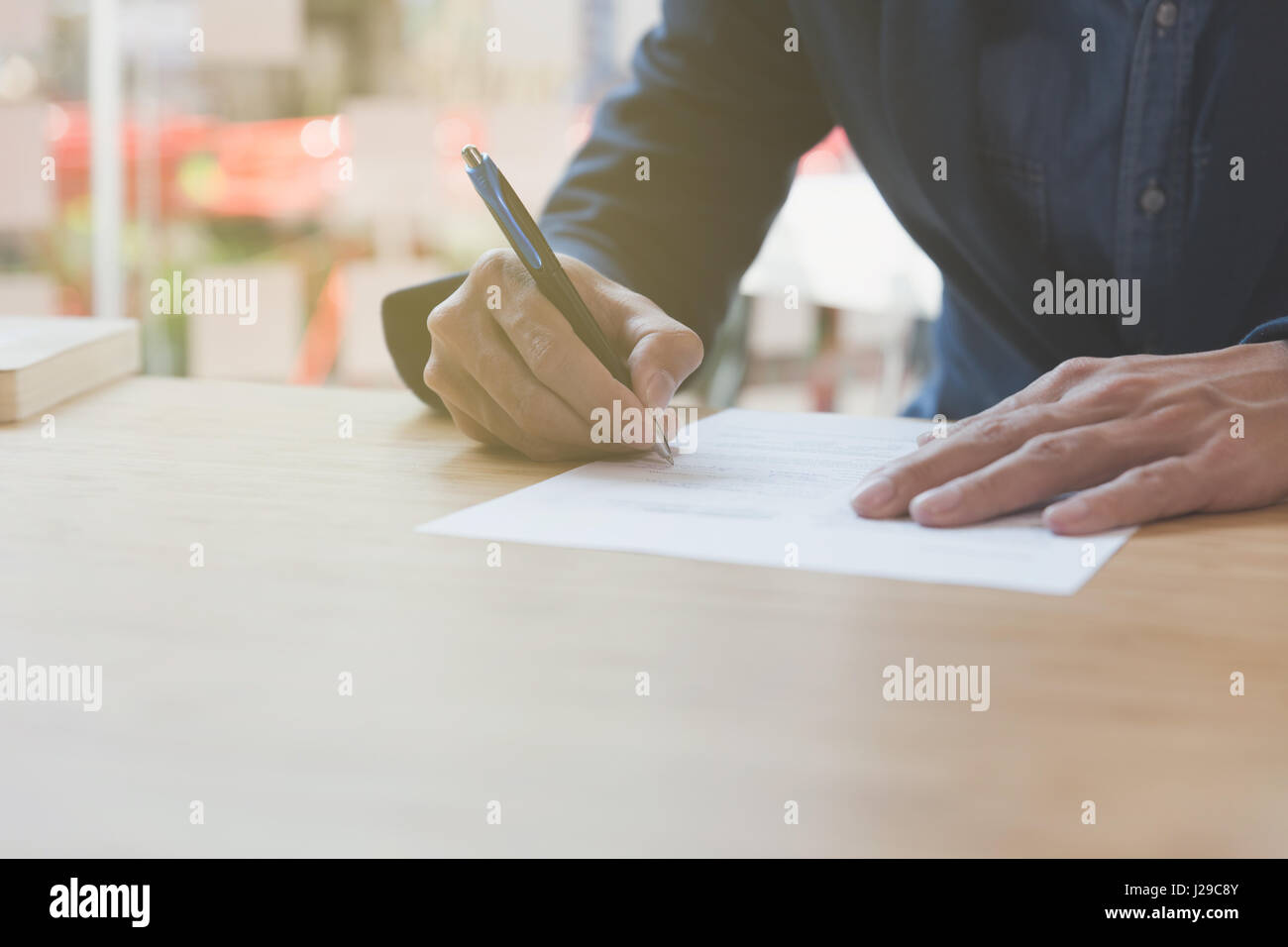 Businessman sign contract. Manager signing paper document at work ...