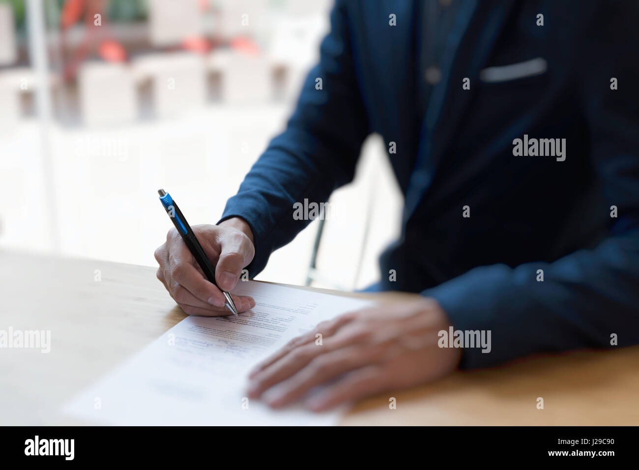 Businessman sign contract. Manager signing paper document at work ...