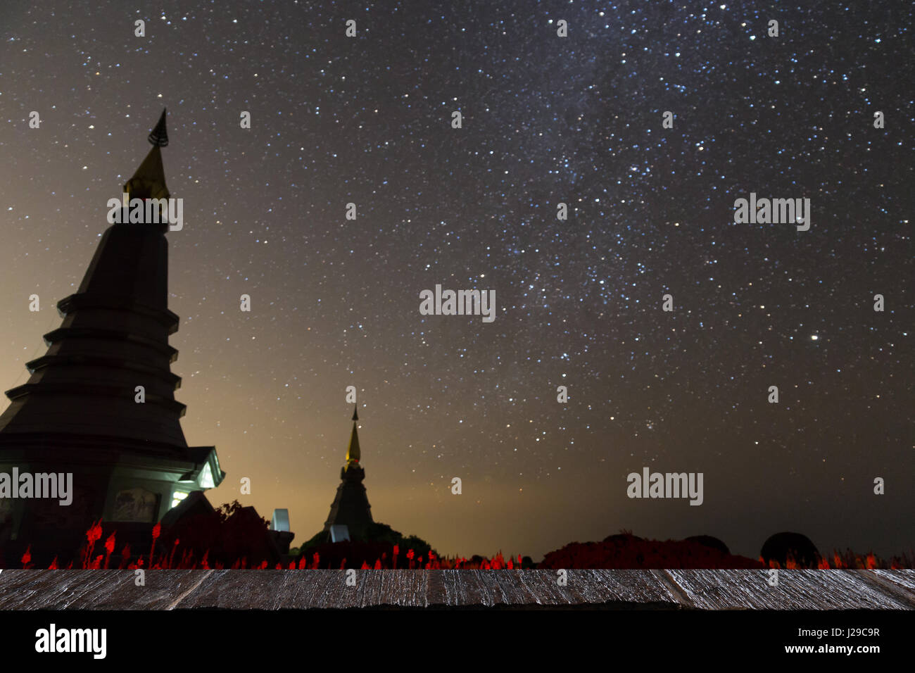 Night sky with lot of shiny stars and two pagoda in Doi Inthanon ...