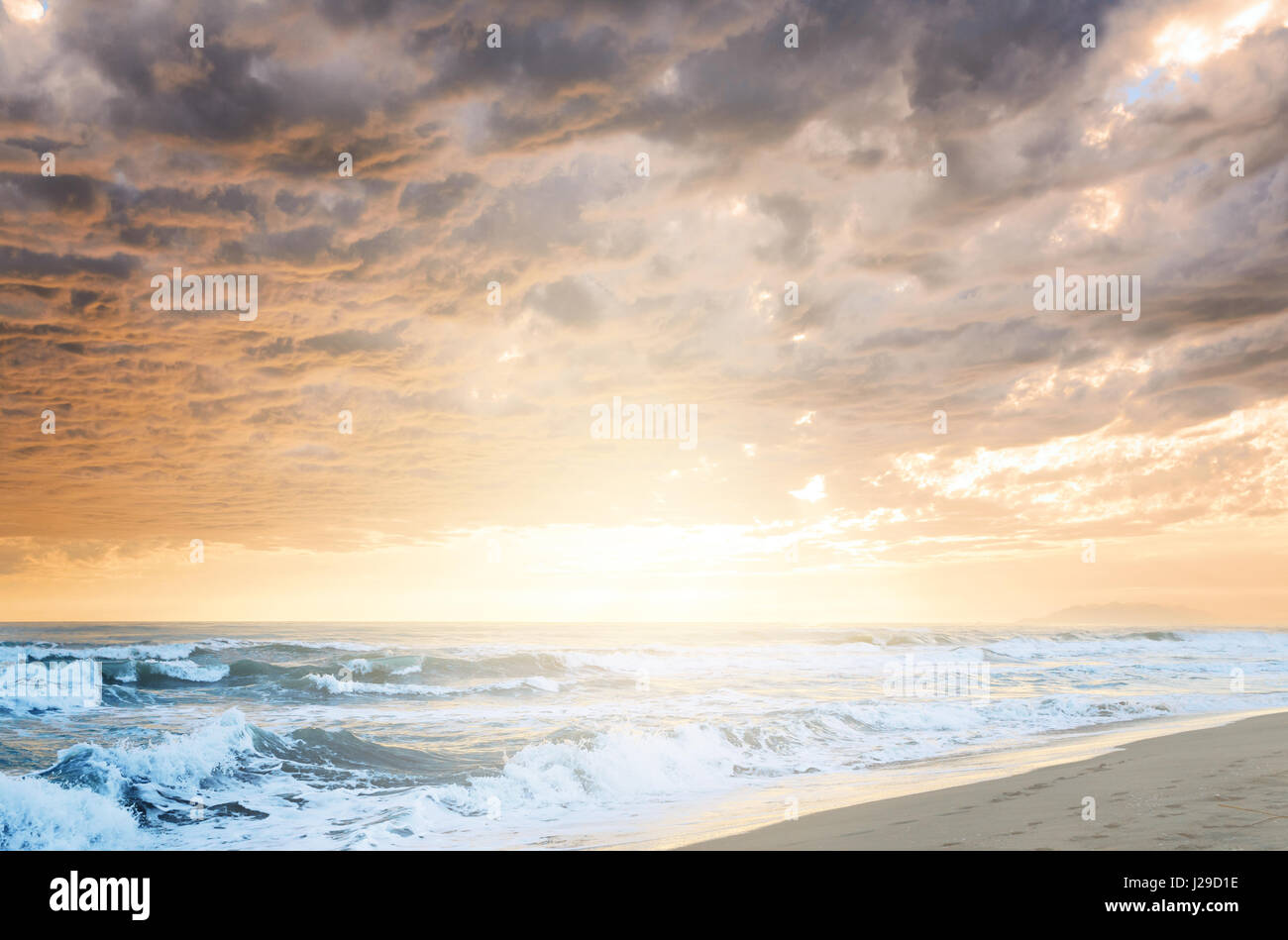 Cloudy sea sunset Stock Photo - Alamy