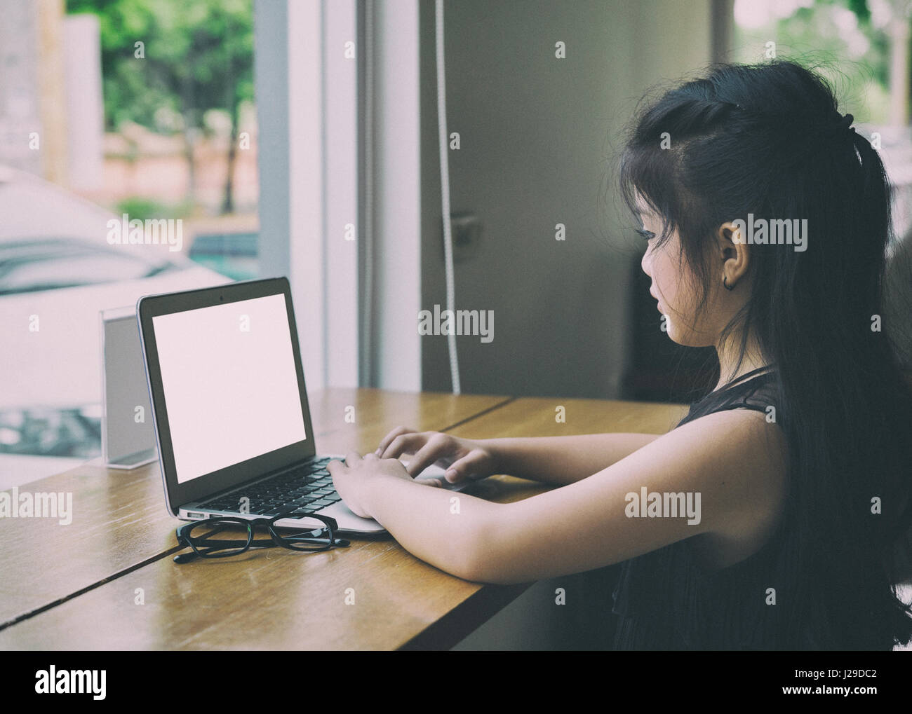 Beautiful asian student girl learning, studying online using laptop ...