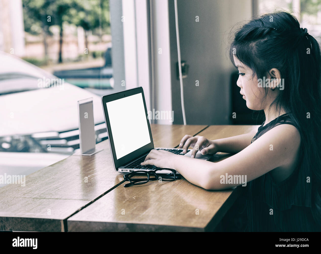 Beautiful asian student girl learning, studying online using laptop ...