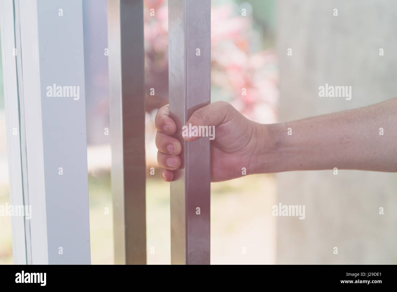 Human hand holding doorknob hi-res stock photography and images - Alamy