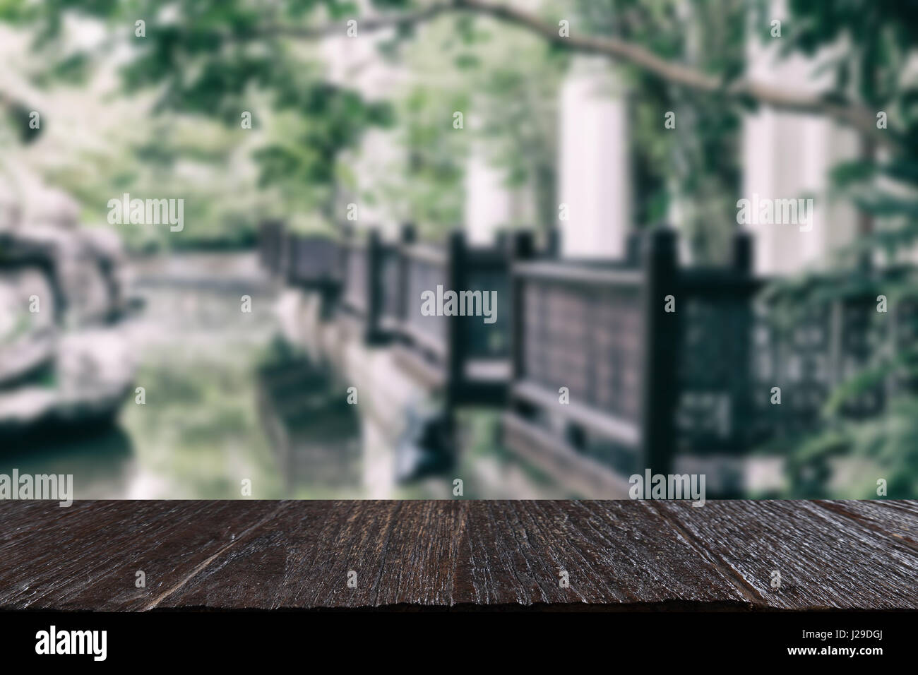 wood balcony terrace beside pond in garden with selected focus wood ...