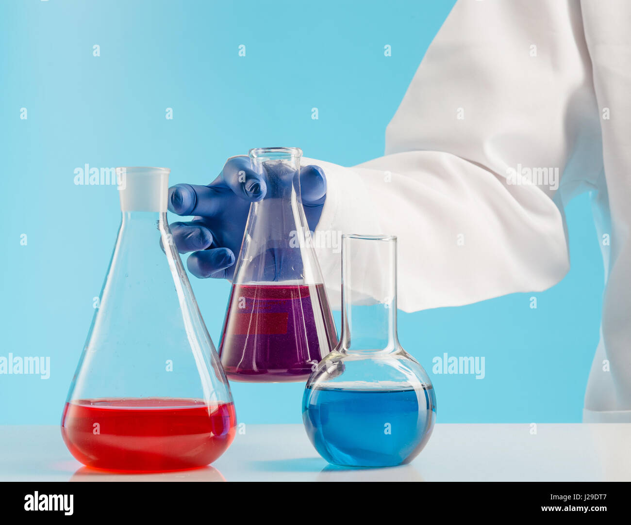 Experiments in a chemistry lab. conducting an experiment in the ...