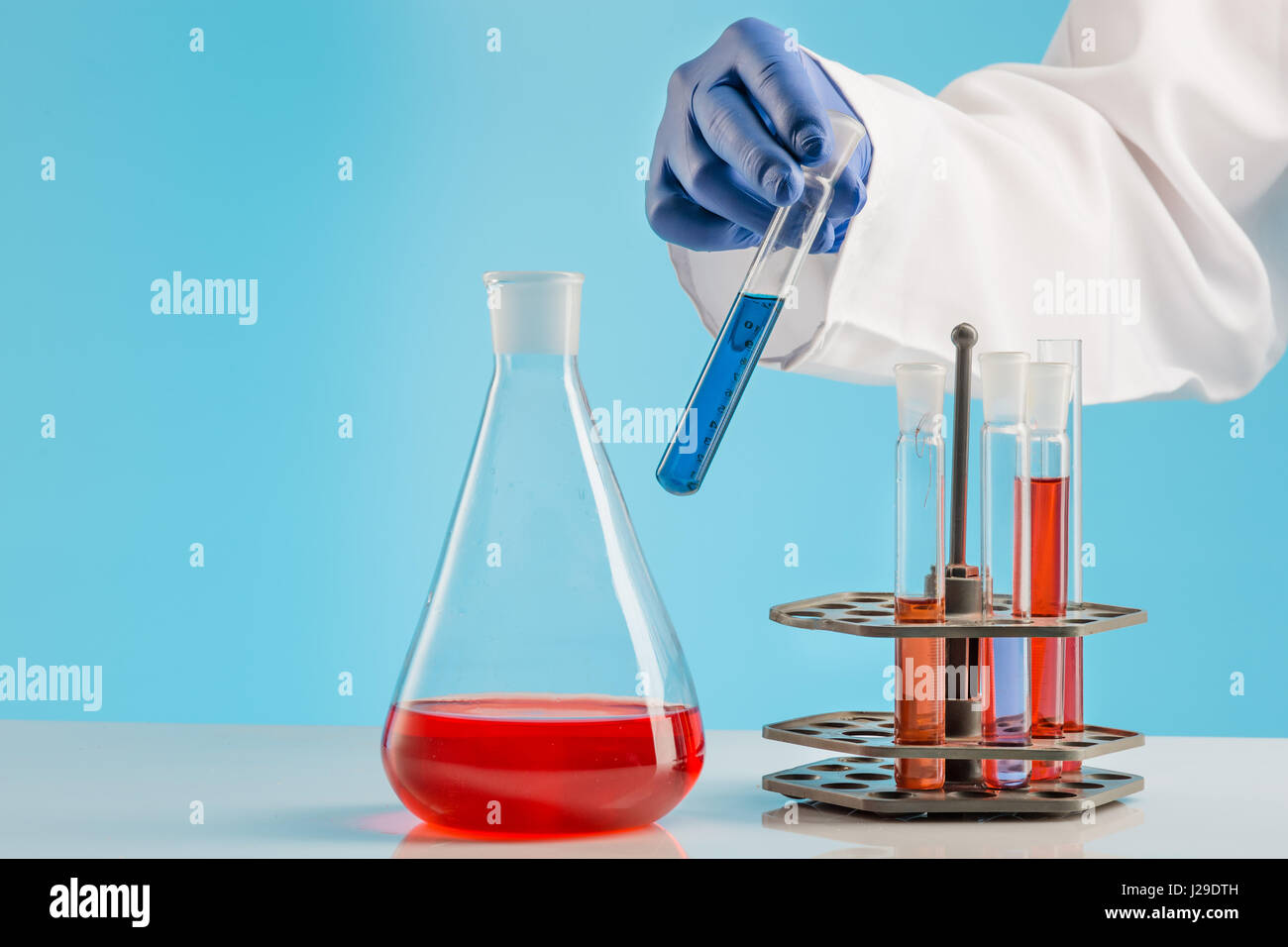 Experiments in a chemistry lab. conducting an experiment in the ...