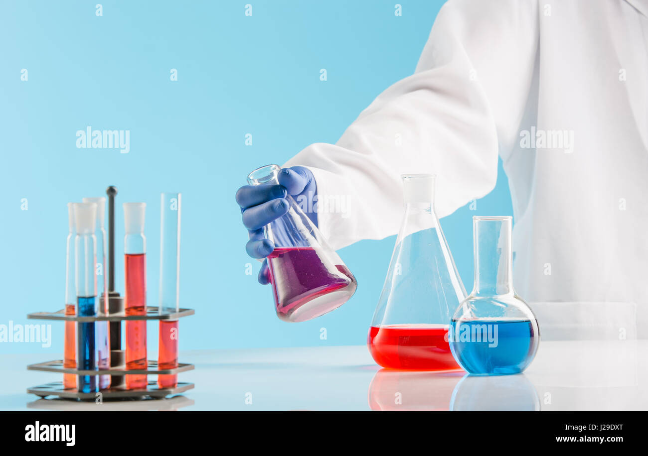 Experiments in a chemistry lab. conducting an experiment in the ...