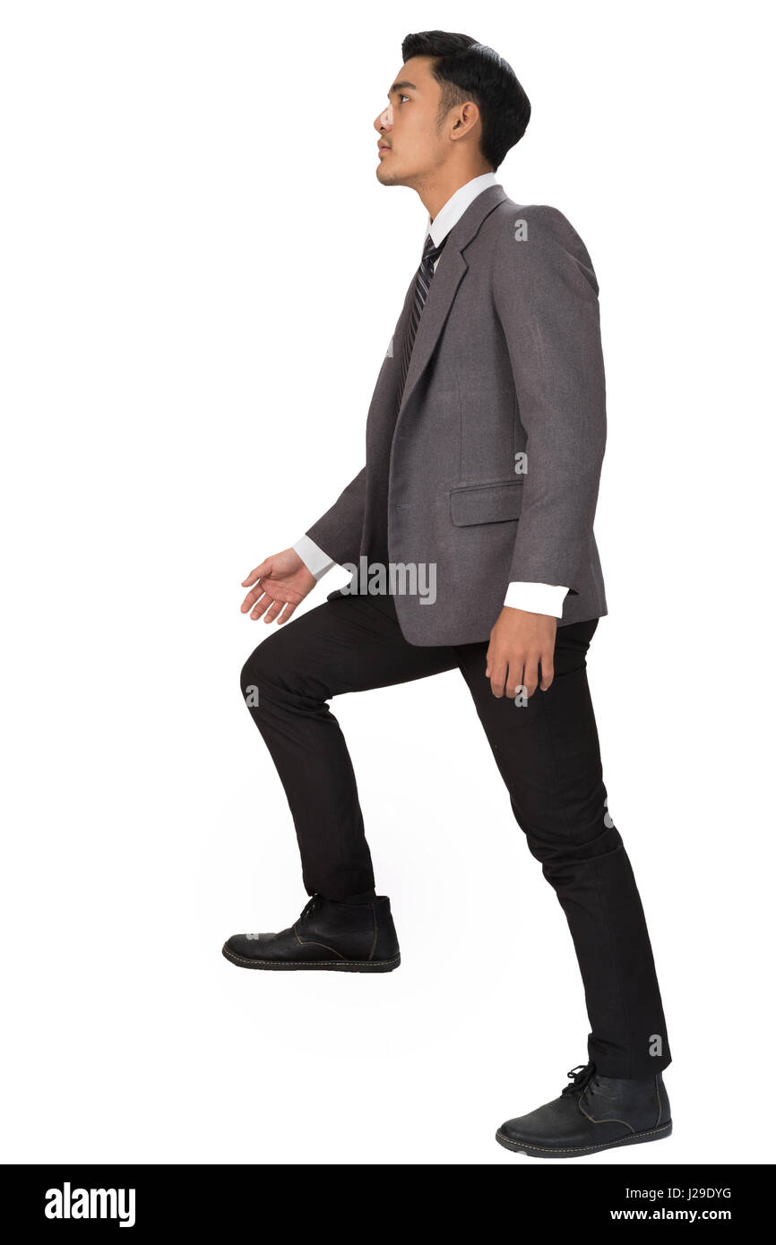 Side view of a man stepping up a staircase. Confident businessman ...