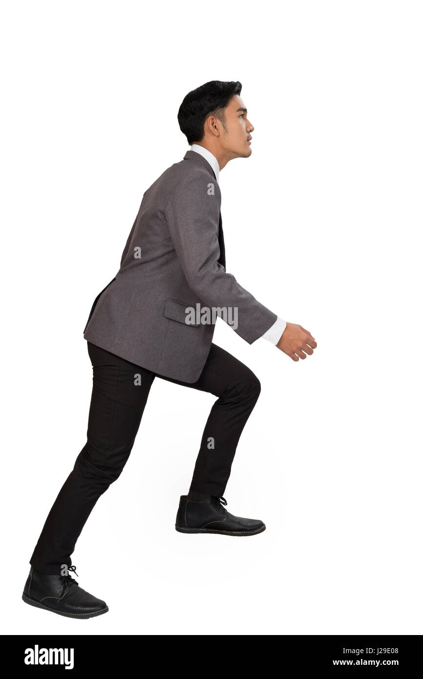 Side view of a man stepping up a staircase. Confident businessman ...