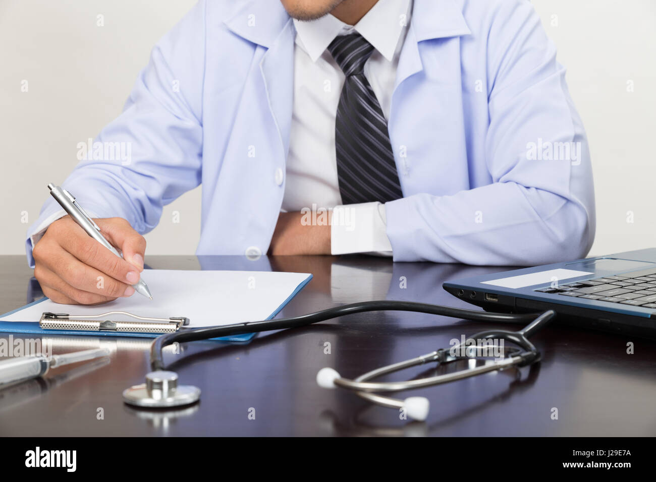 Doctor working in hospital writing RX prescription, Healthcare and ...