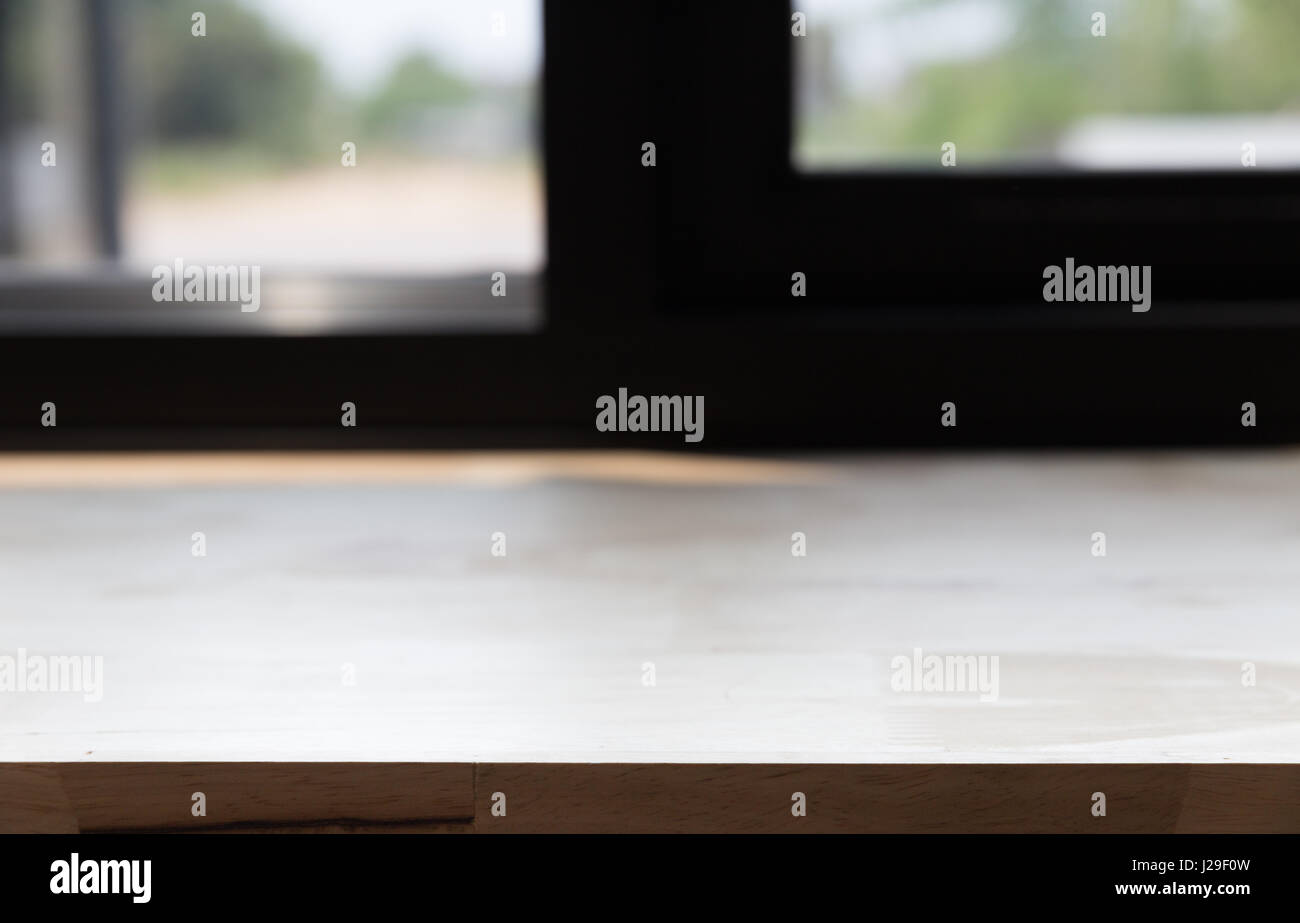 Wooden table beside window for your product placement or montage with ...