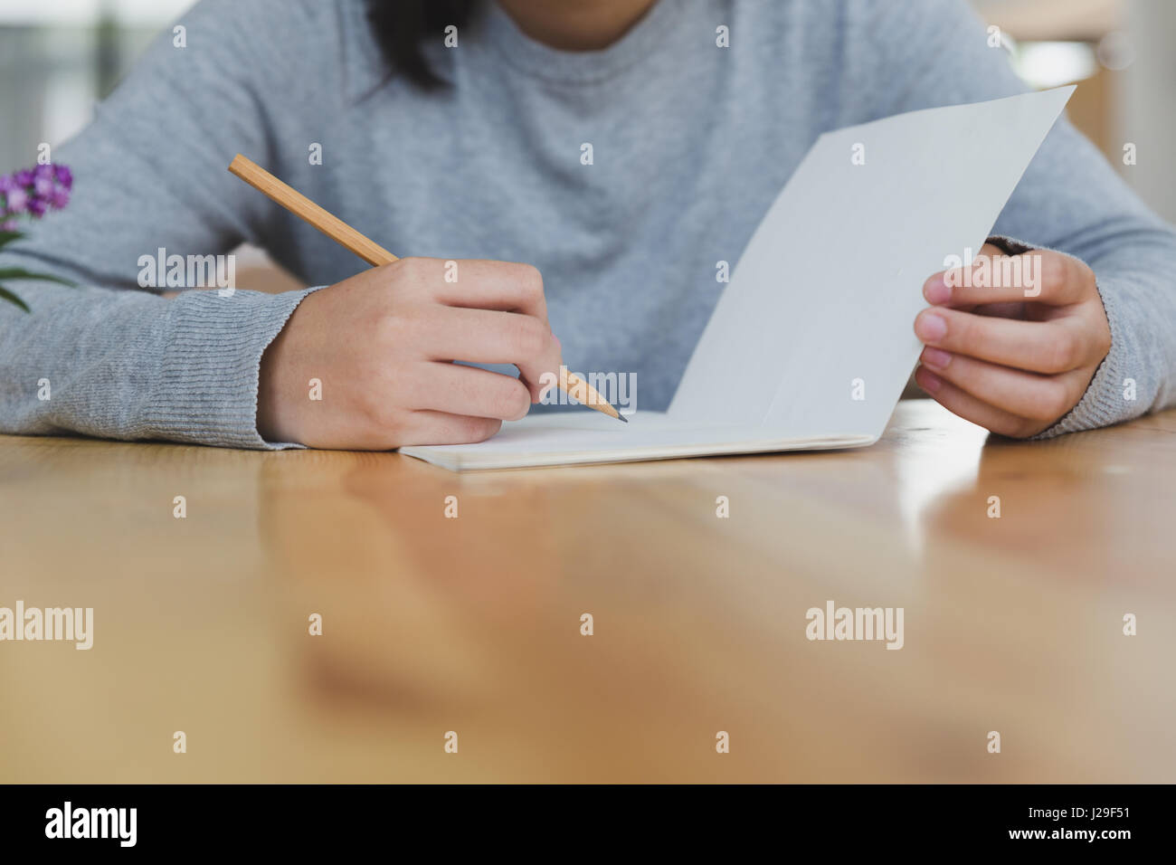 asian girl female teenager studying at school. Student writing note on ...