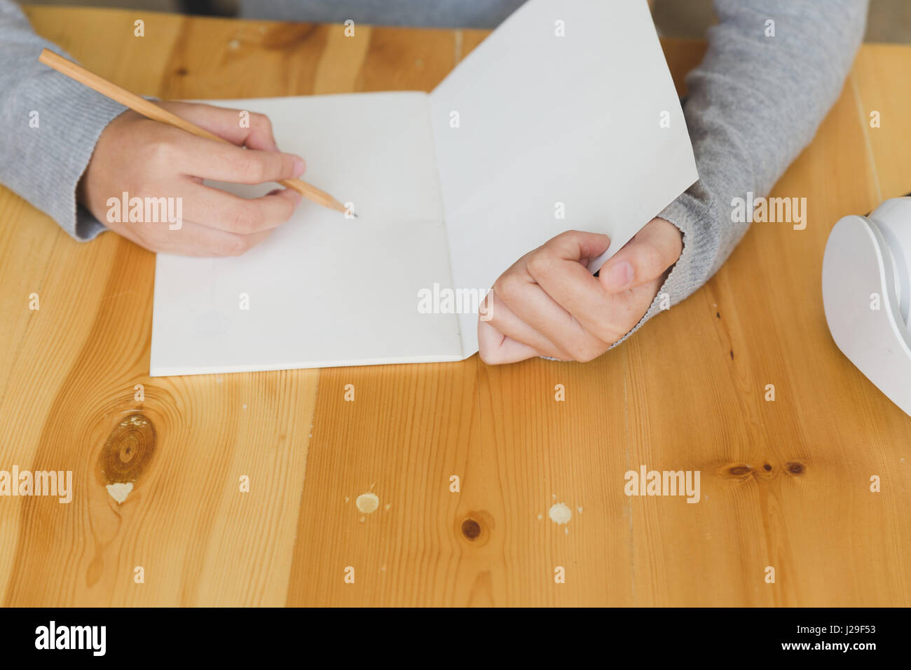 asian girl female teenager studying at school. Student writing note on ...