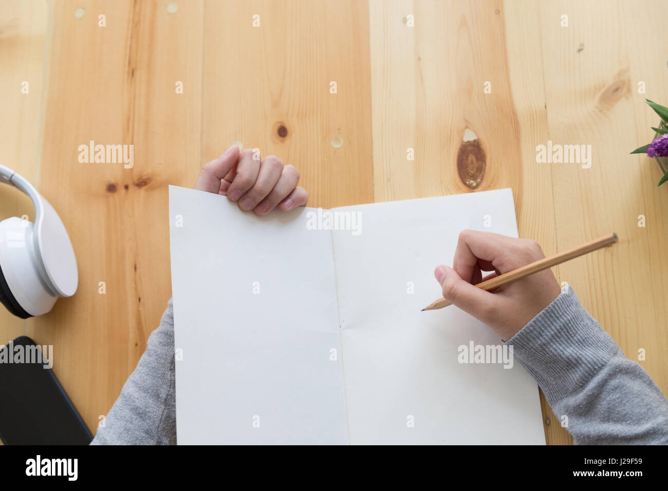 asian girl female teenager studying at school. Student writing note on ...