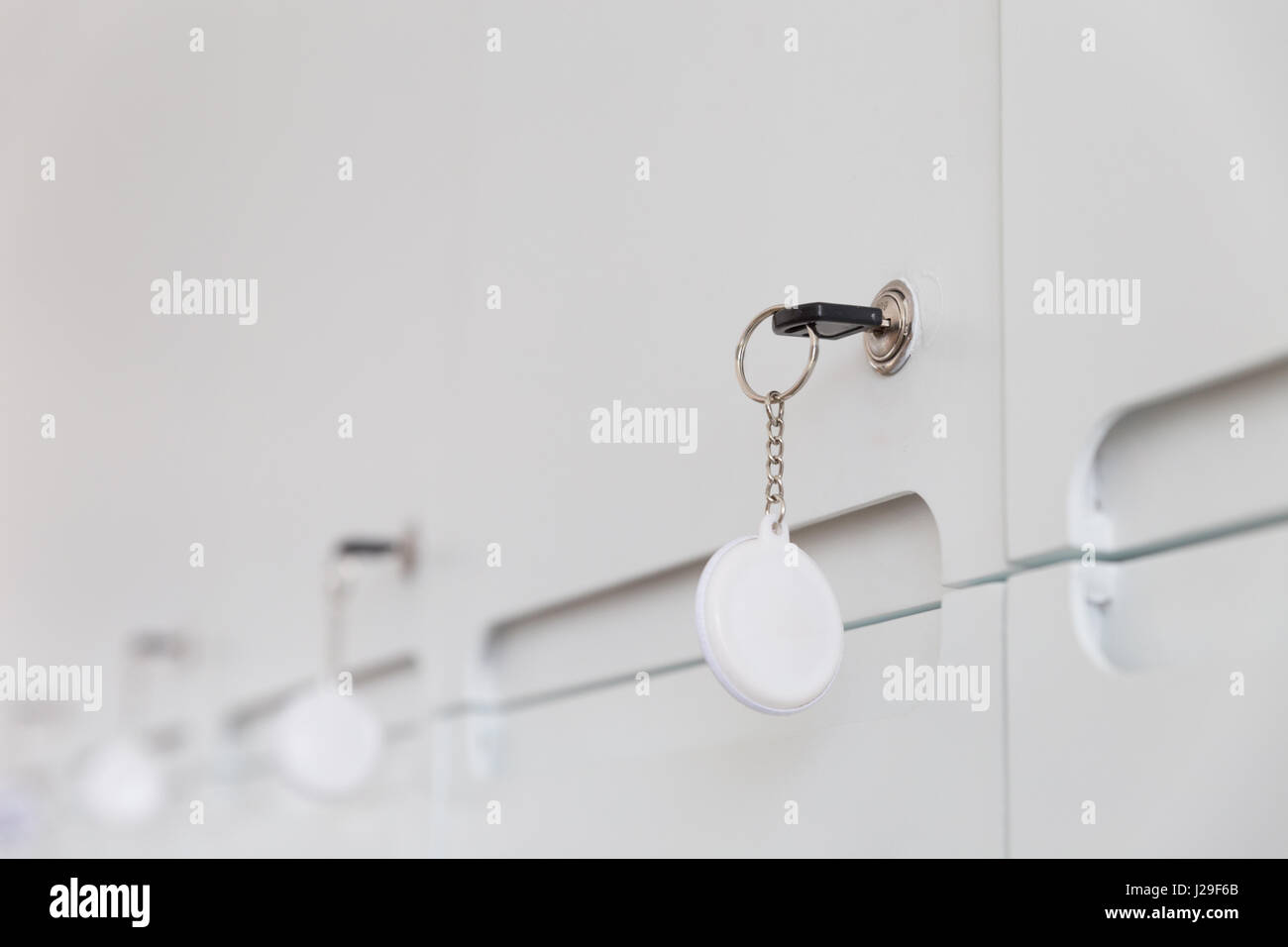 key and new white locker in school or office Stock Photo - Alamy