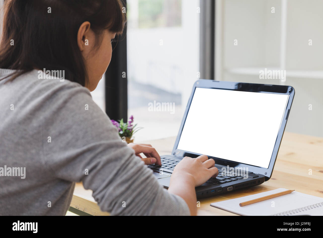 asian girl female teenager studying at school. Student typing on laptop ...