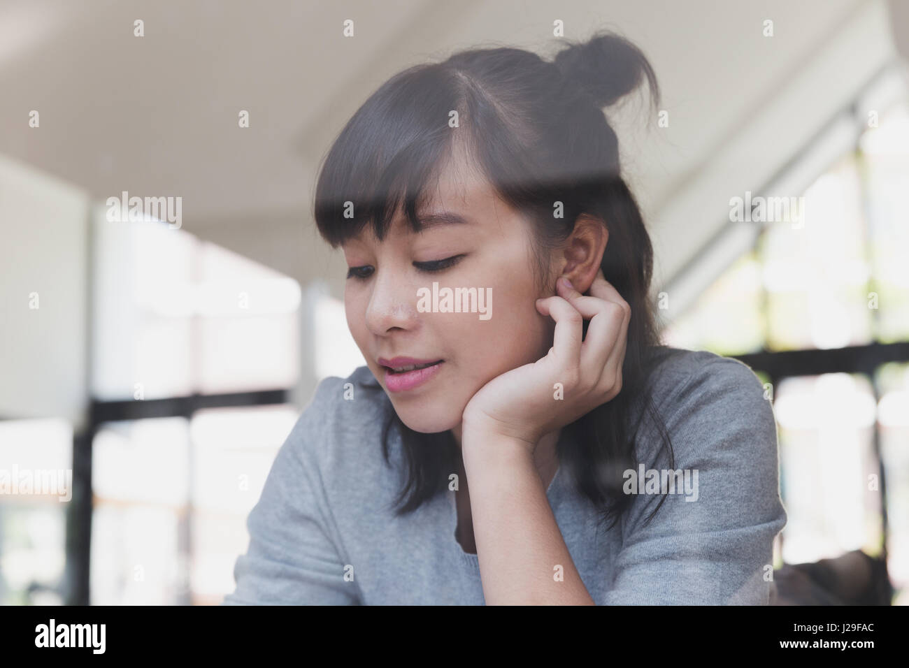 asian girl female teenager lying and studying at school. Student lying ...