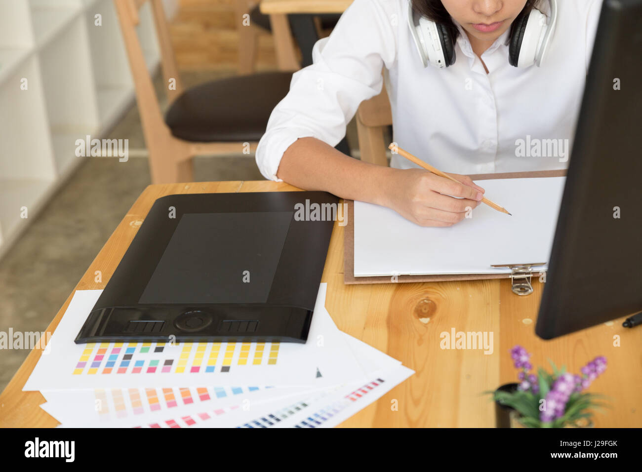 freelance artist graphic designer drawing on white paper with digital ...
