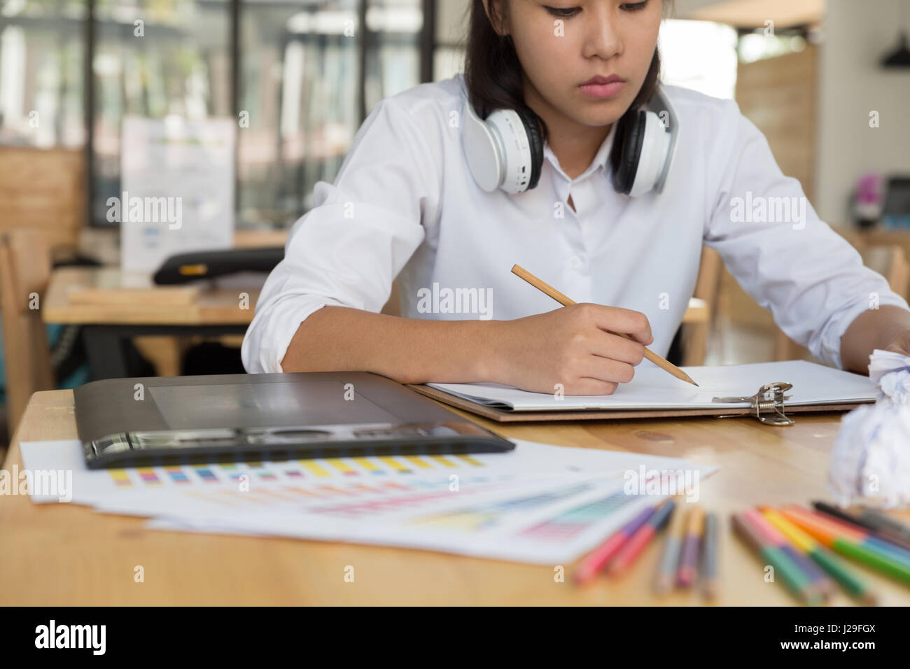 freelance artist graphic designer drawing on white paper with digital ...