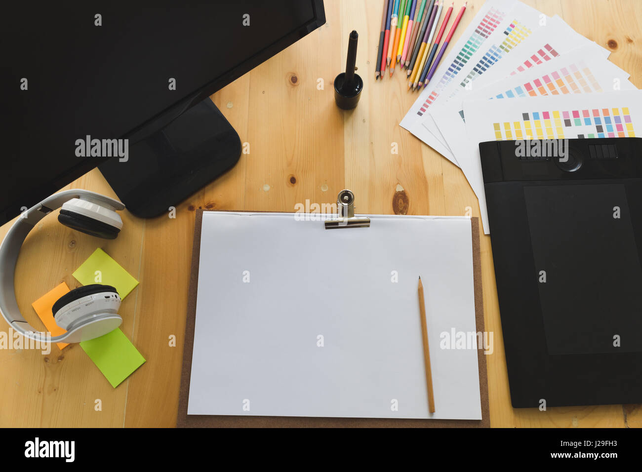 desk of graphic designer artist at work - digital tablet, computer ...
