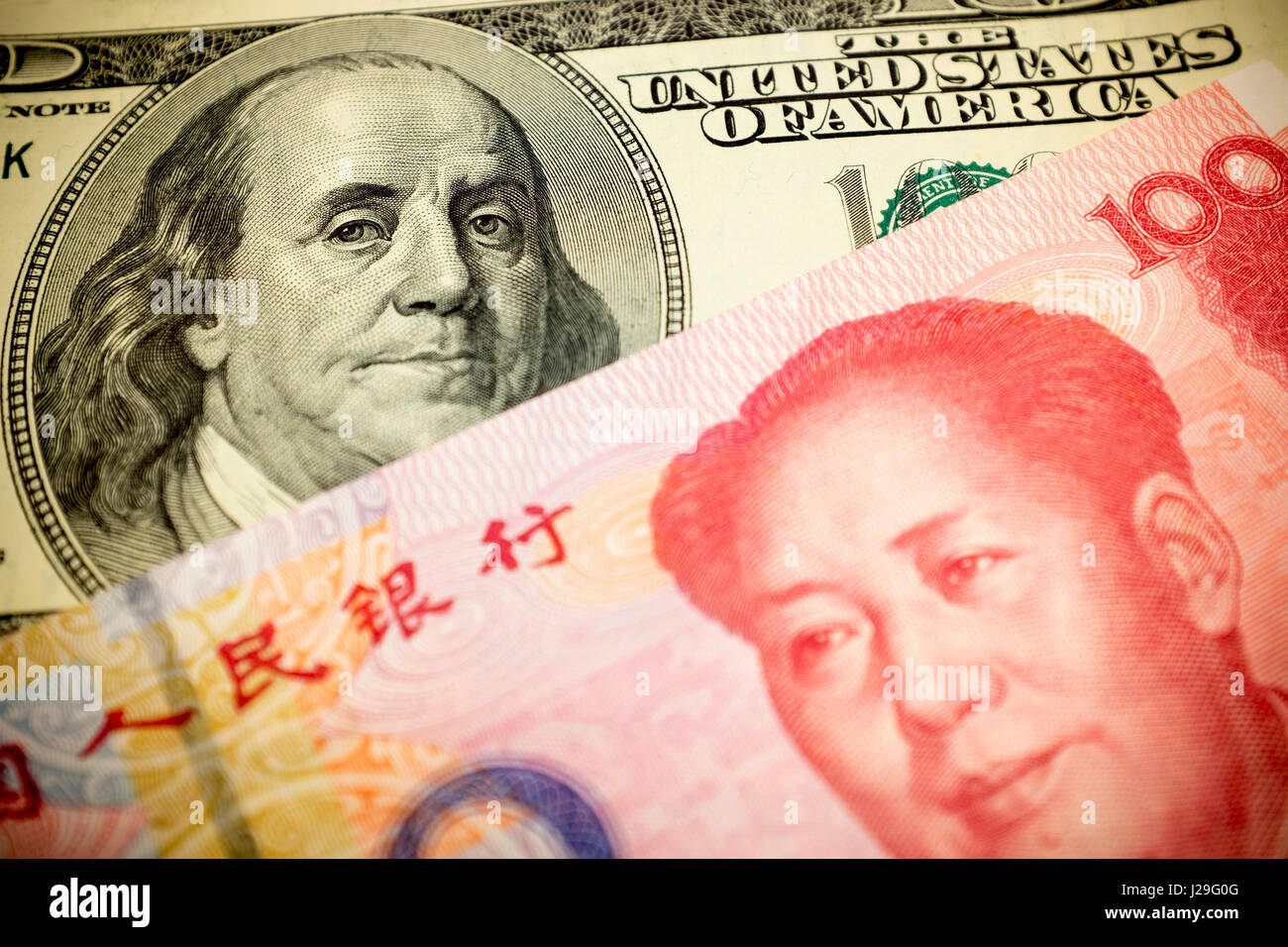 Chinese Yuan Note and U.S. dollar background (Exchange rate concept ...