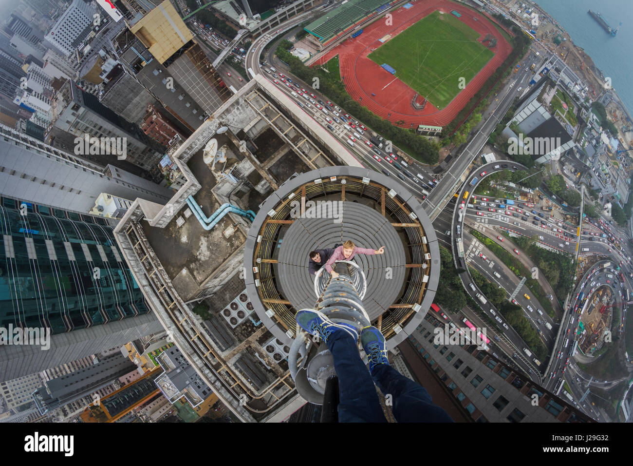 The rooftoppers climb to the top of a metal column. MIND-BLOWING pictures of a team of thrill ...