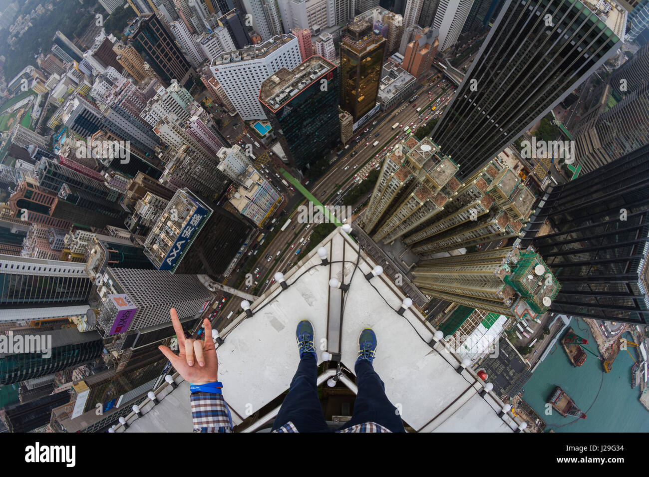 Rooftopper Denis Krasnov looks down over the traffic. MIND-BLOWING ...