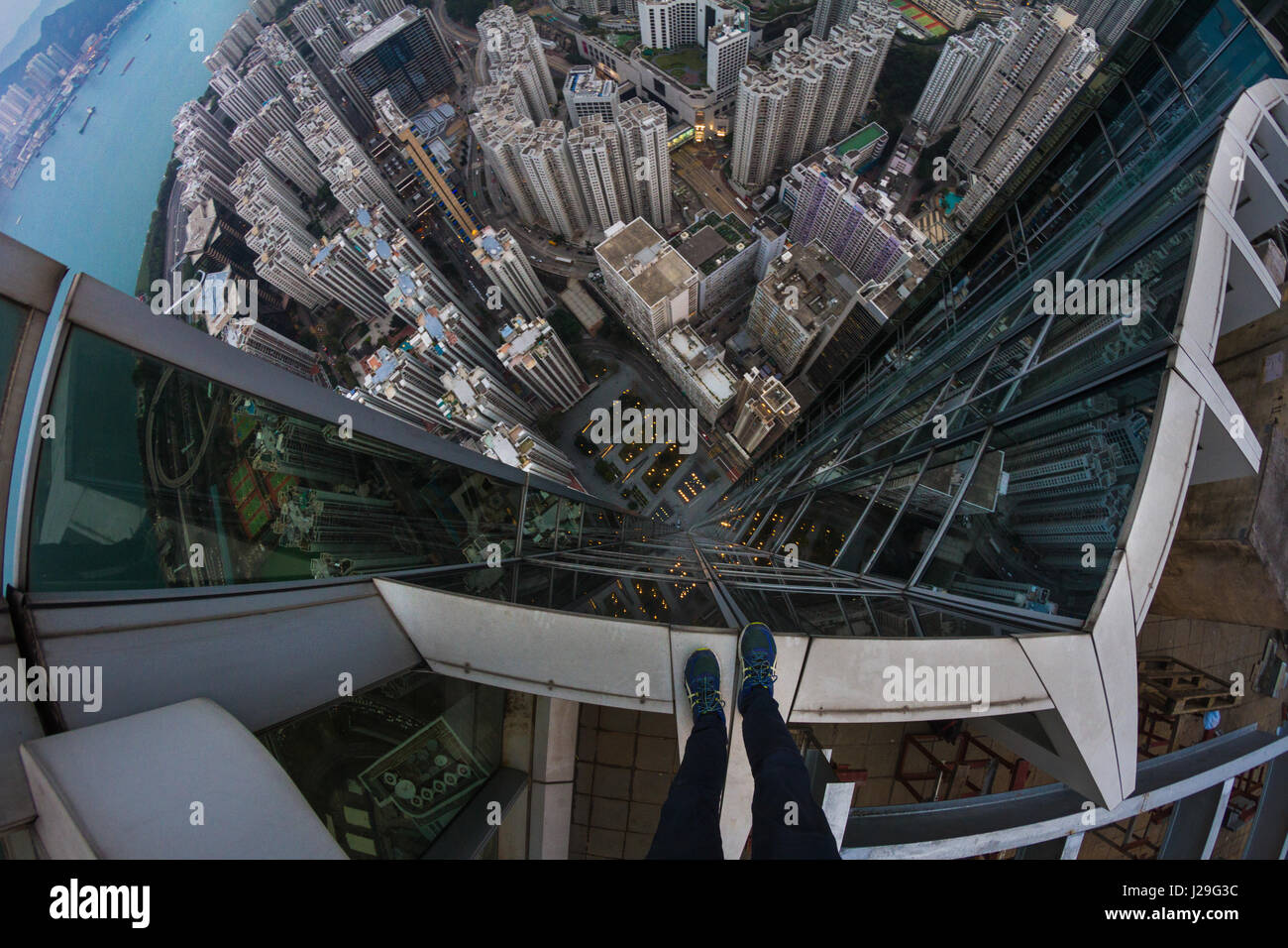 Rooftopper Denis Krasnov looks down over the traffic. MIND-BLOWING pictures of a team of thrill ...
