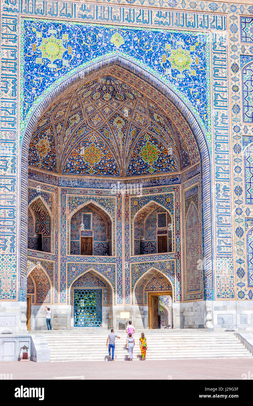 SAMARKAND, UZBEKISTAN - AUGUST 8: People passing in front of Sher-Dor ...