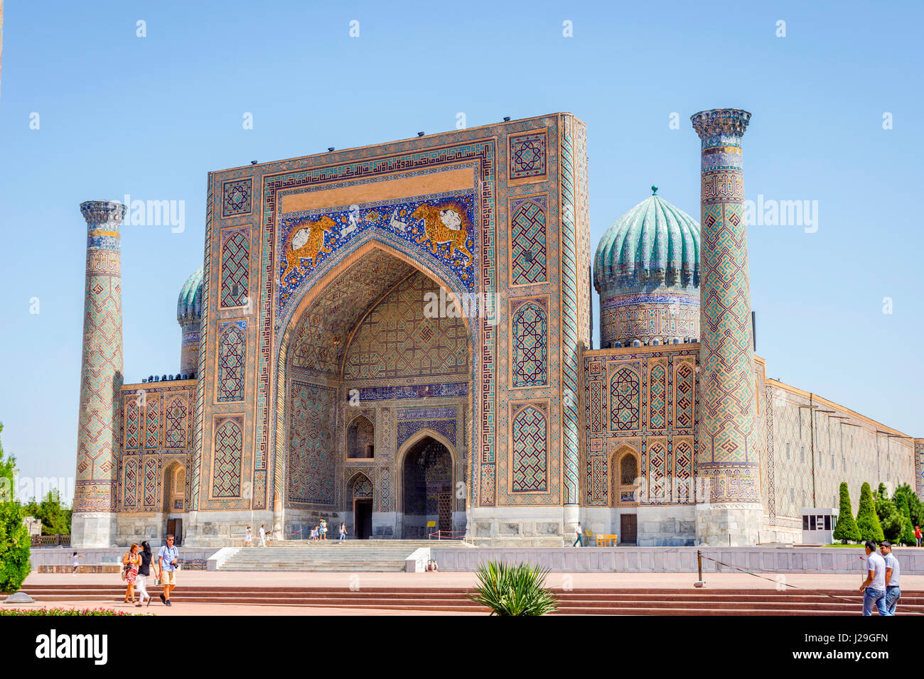 SAMARKAND, UZBEKISTAN - AUGUST 28: People walking in front of Registan ...
