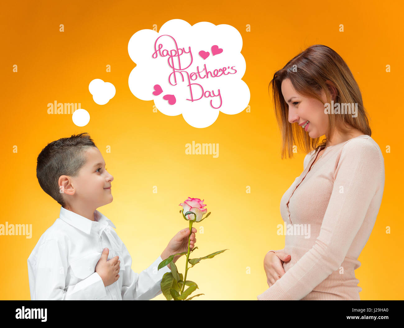 Young kid giving red rose to his mom Stock Photo - Alamy