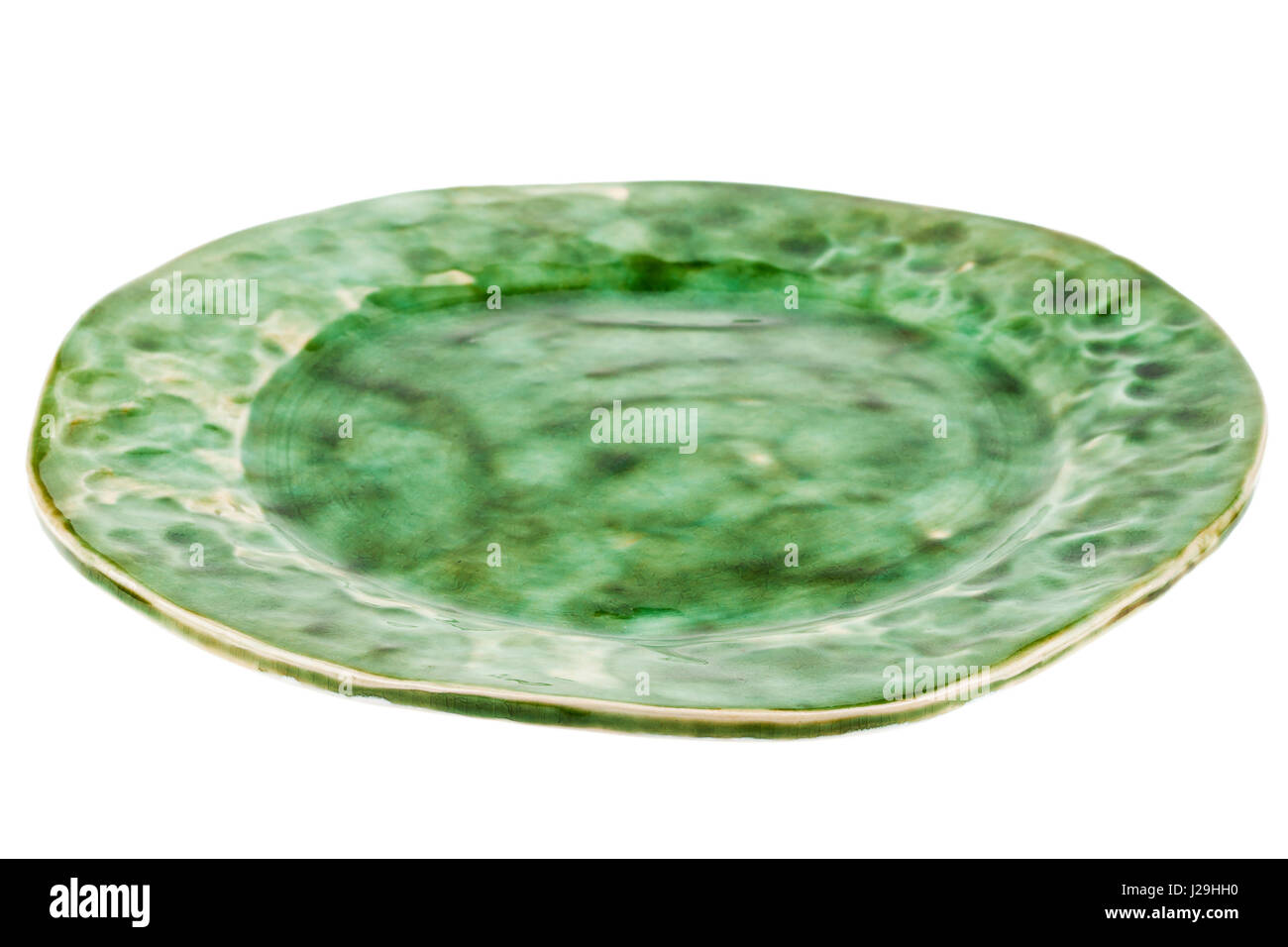 Green handmade pottery plate isolated on white background Stock Photo ...
