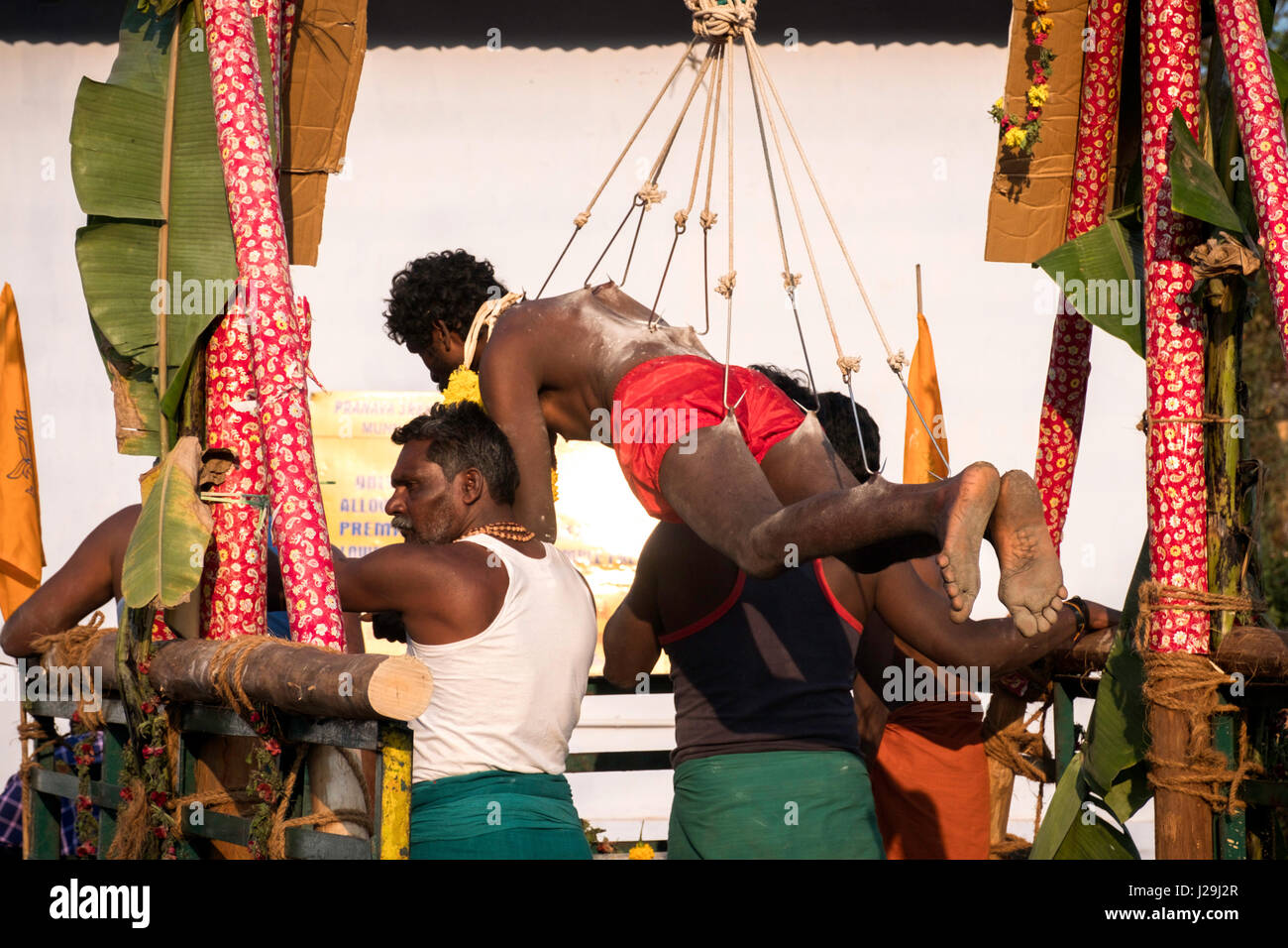A fakir, considered as a holy man, participates in a procession hung ...
