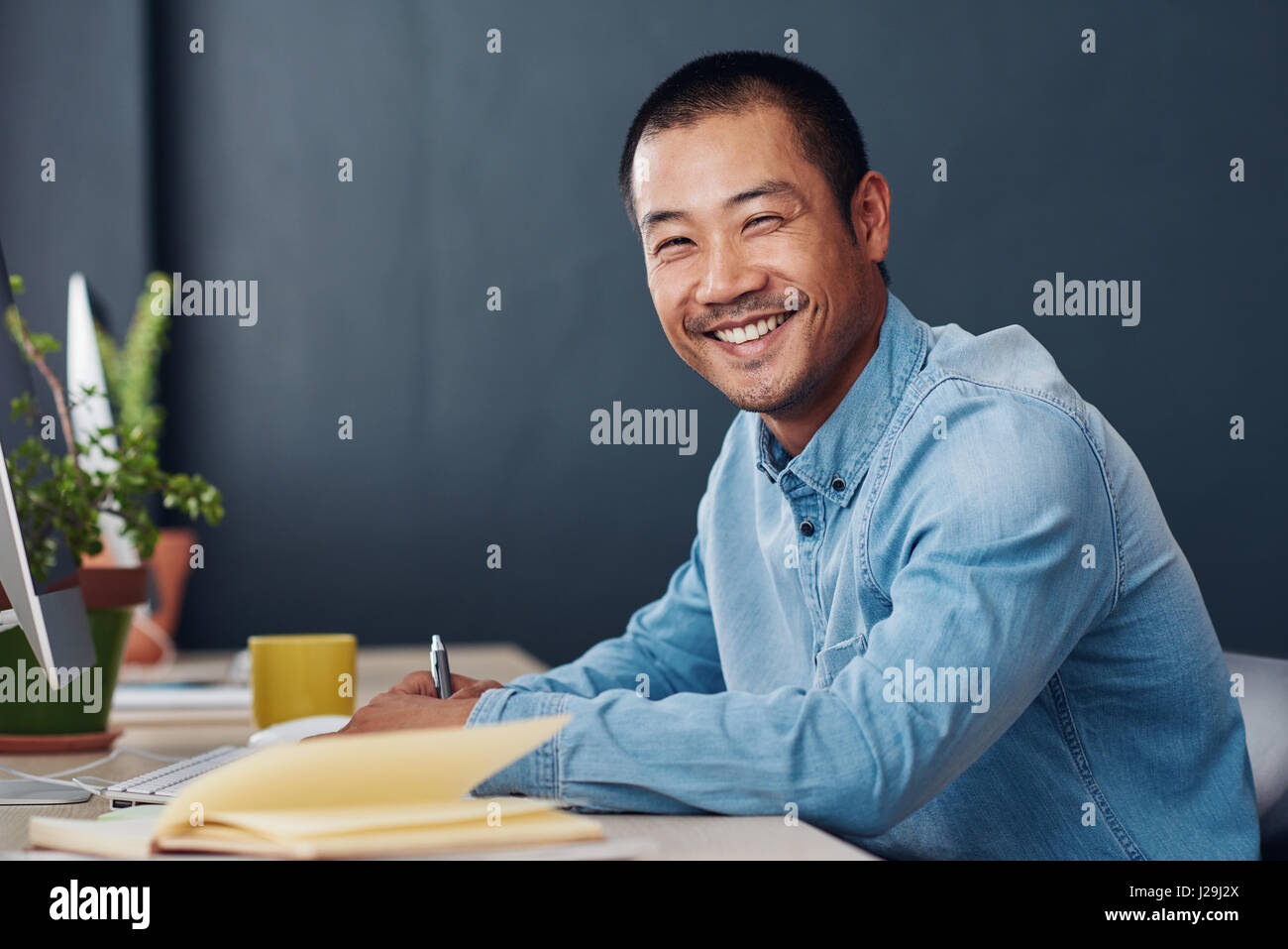Young asian man working computer hi-res stock photography and images ...