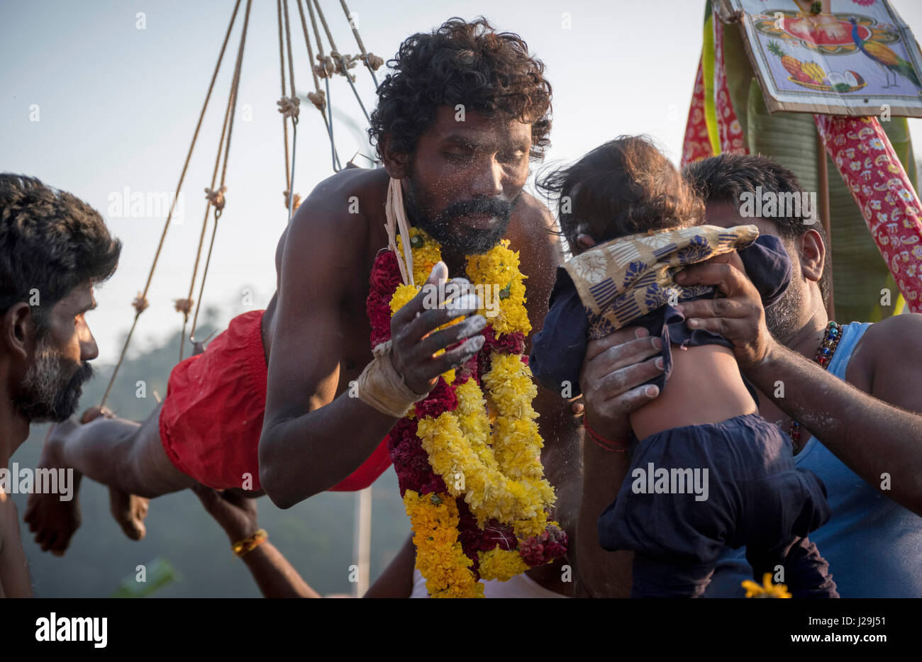 A fakir, considered as a holy man, participates in a procession hung ...