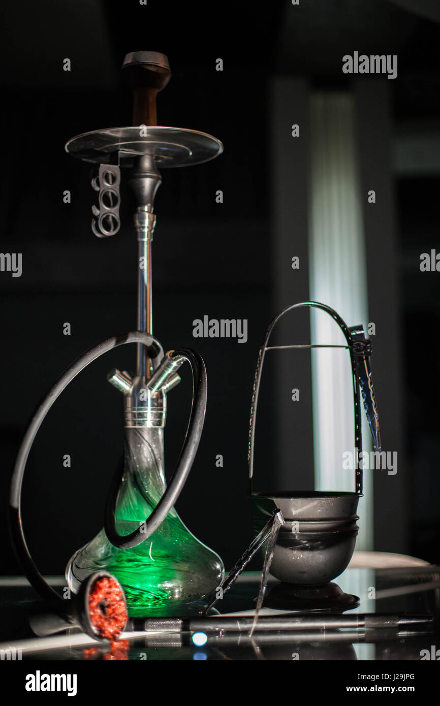 Green shisha on the dark background Stock Photo - Alamy