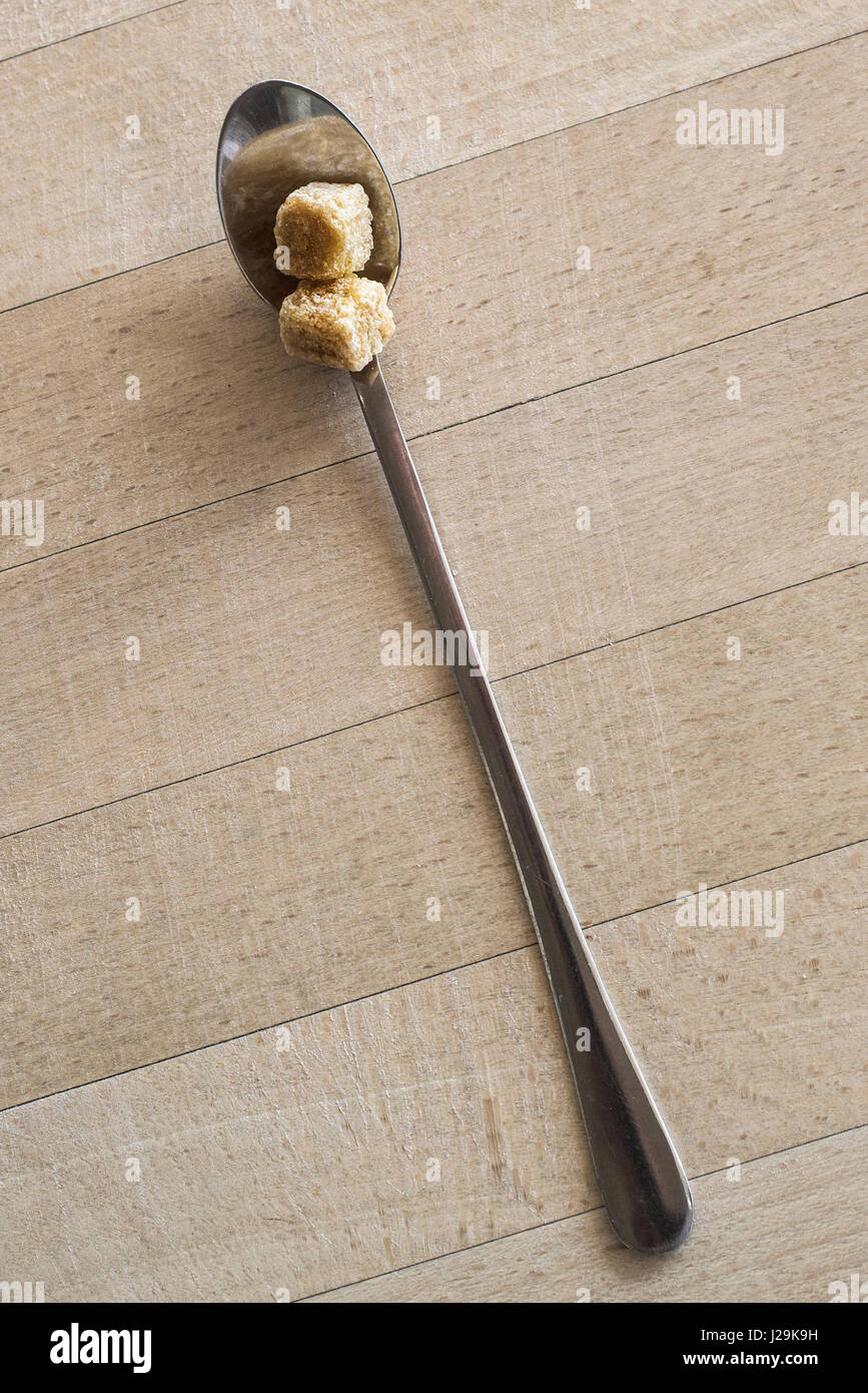 Spoon Sugar cubes Brown sugar Table top Stock Photo - Alamy Spoon Sugar cubes Brown sugar Table top Stock Photo - Alamy