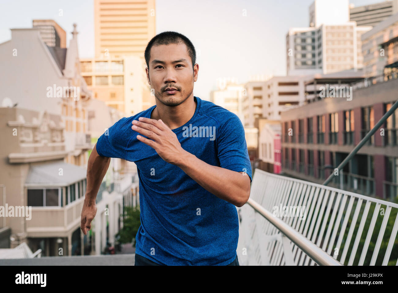 Asian guy running hi-res stock photography and images - Alamy