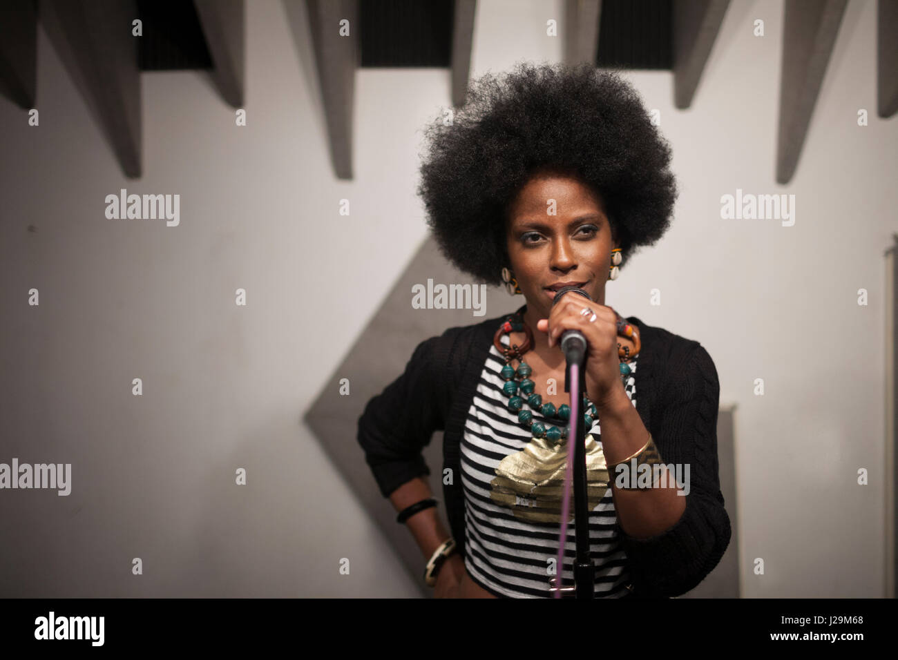 Singer performing in a recording studio Stock Photo - Alamy