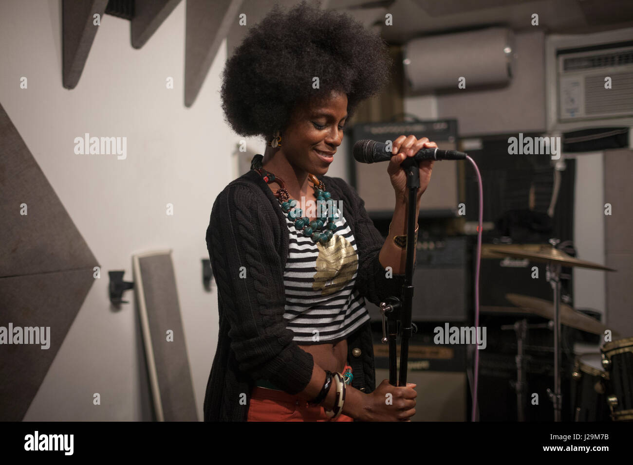 Singer performing in a recording studio Stock Photo - Alamy