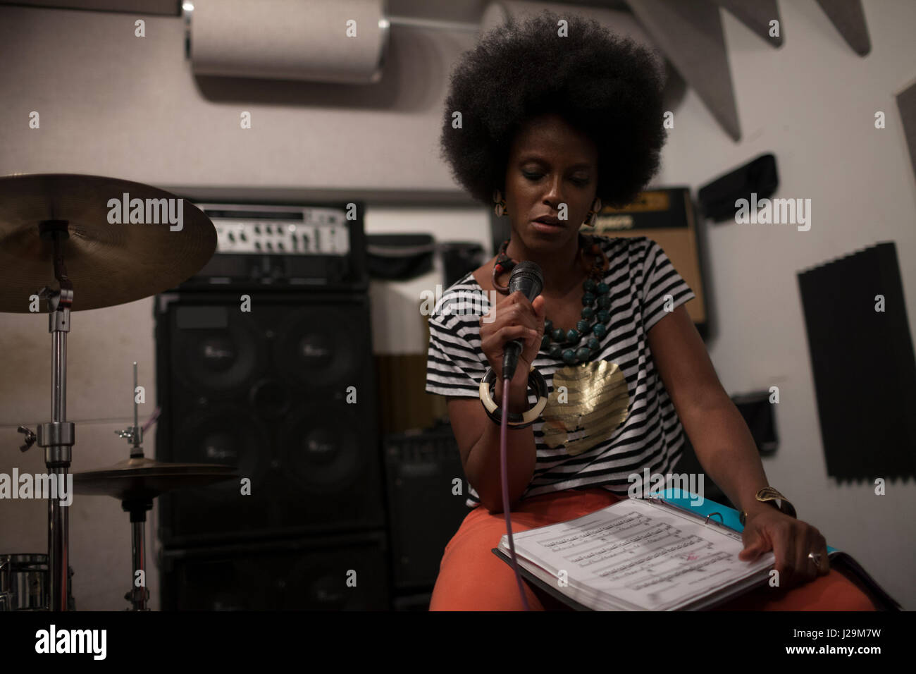 Singer performing in a recording studio Stock Photo - Alamy