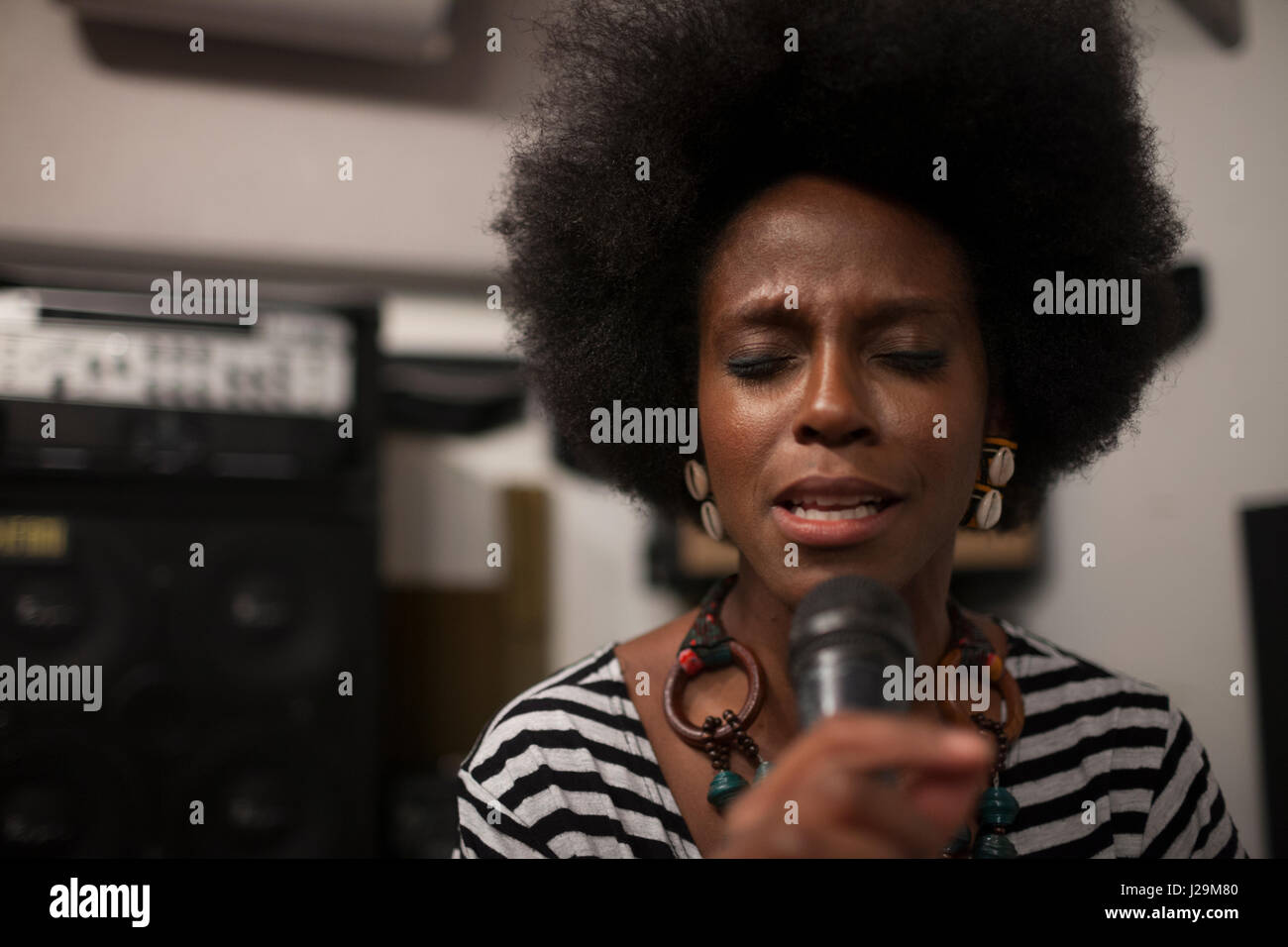 Singer performing in a recording studio Stock Photo - Alamy
