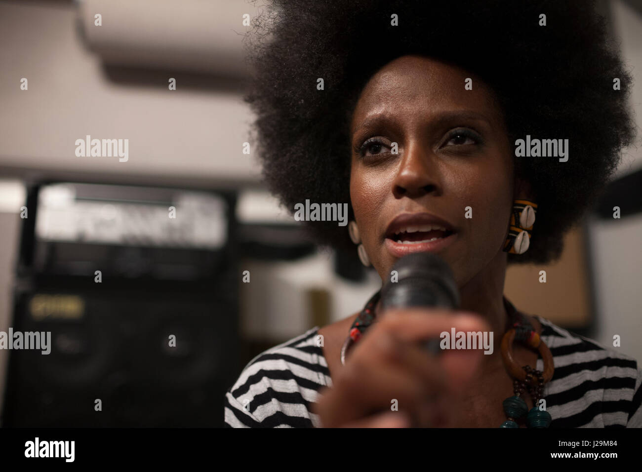 Singer performing in a recording studio Stock Photo - Alamy