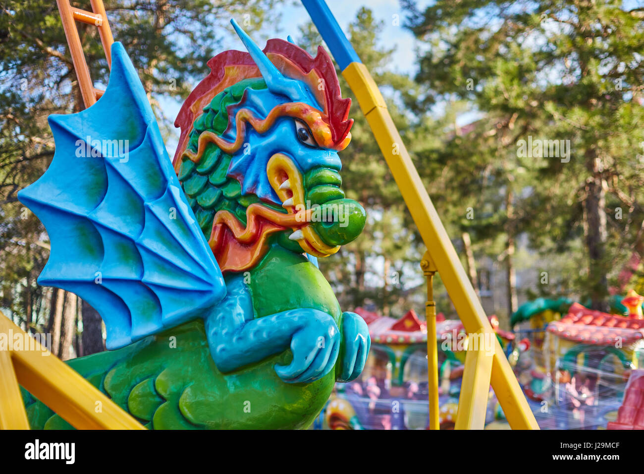 Colored dragon, attraction, children's park Stock Photo - Alamy