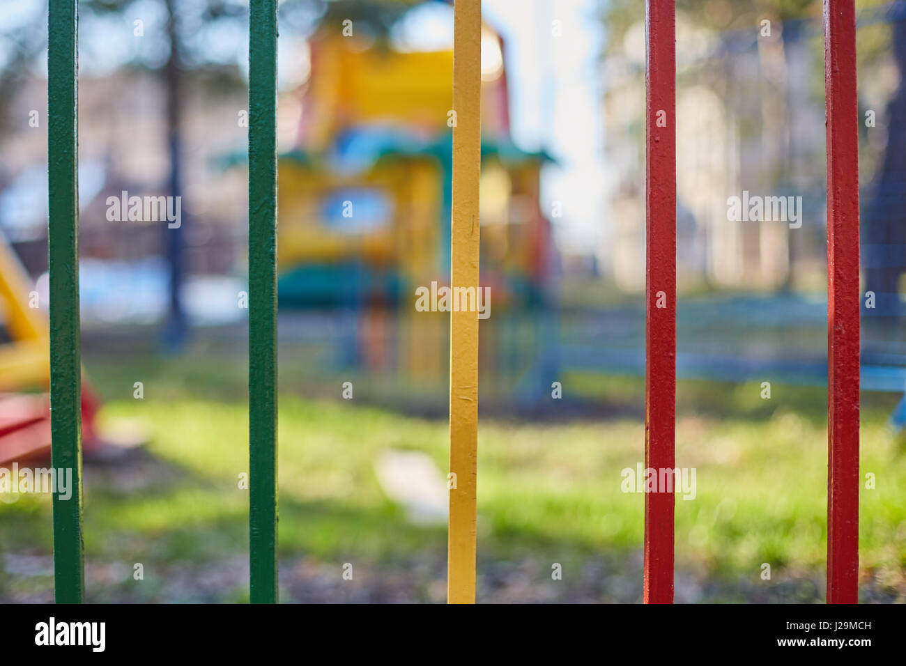 Fence of colored iron rods Stock Photo - Alamy