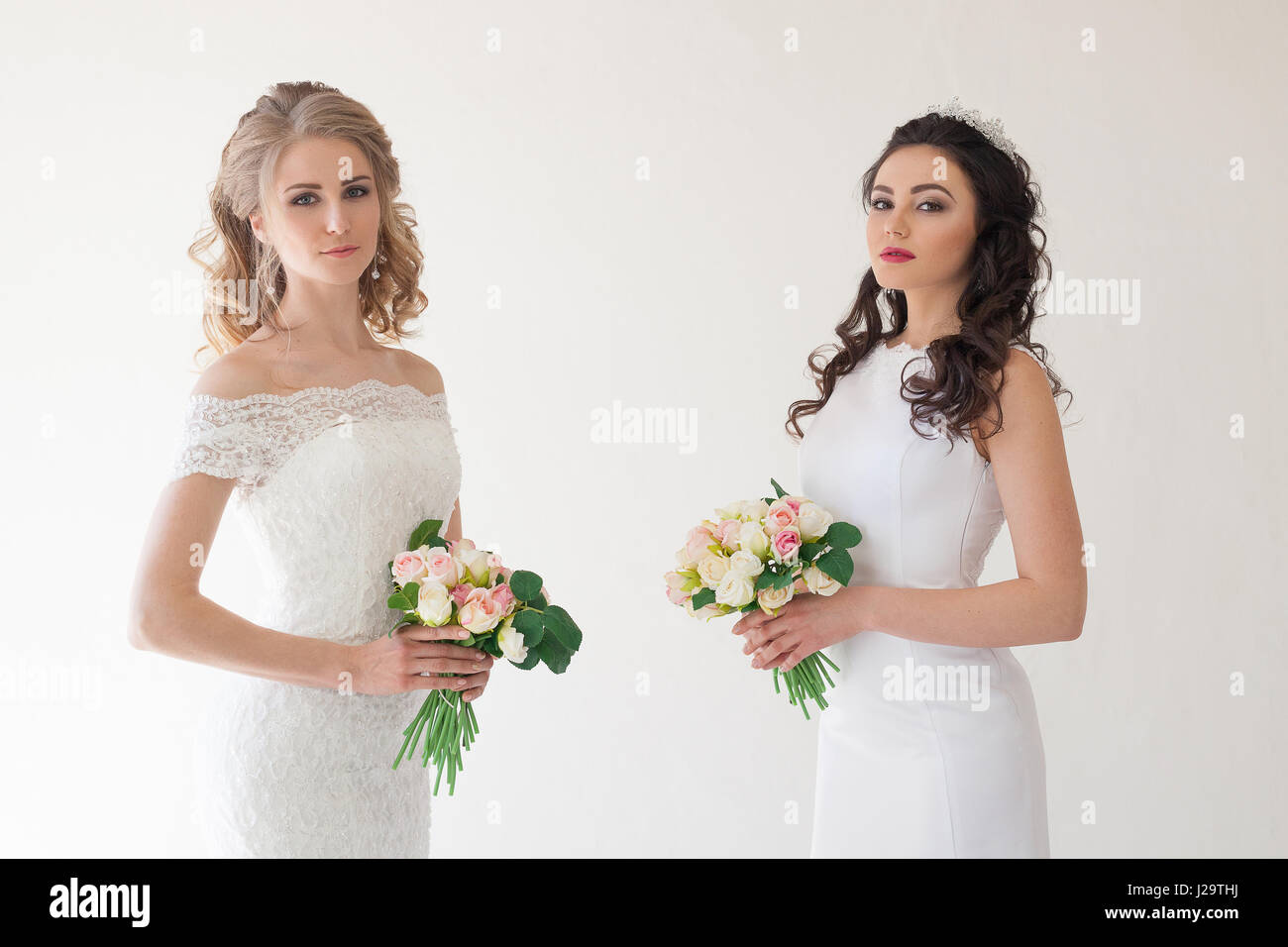 two wedding bride with bouquet wedding Stock Photo - Alamy