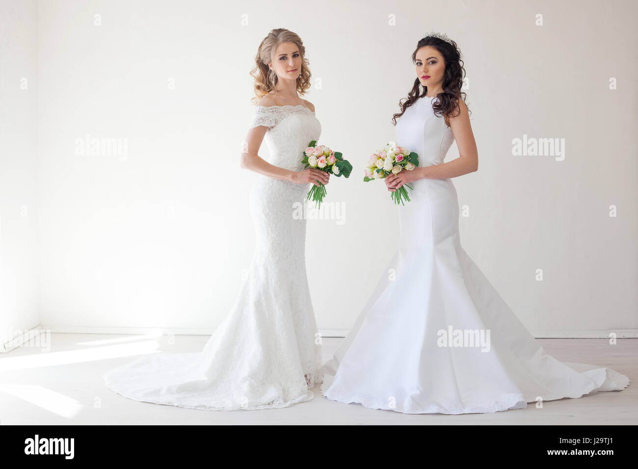 two wedding bride with bouquet wedding Stock Photo - Alamy